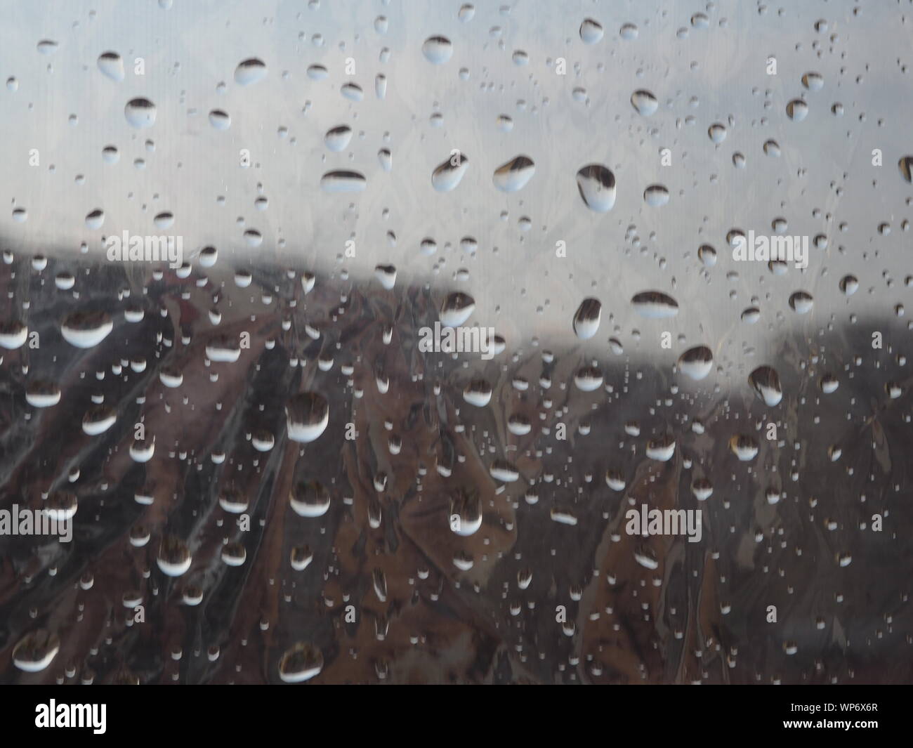 Water drop on glass window and rain condensation rainy storm season ...