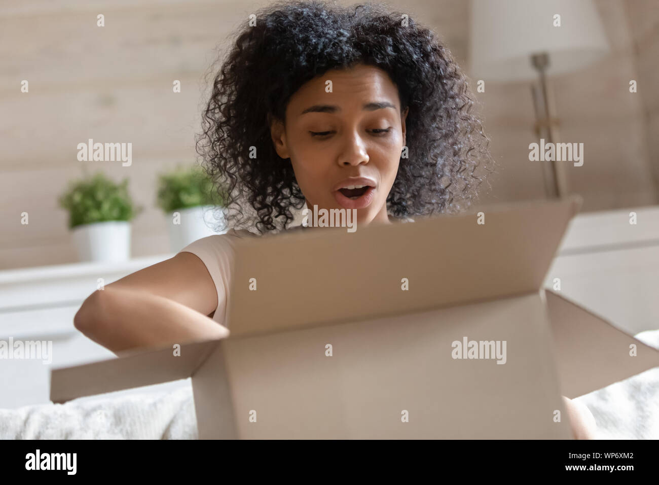 Frustrated african American woman disappointed with delivery service ...