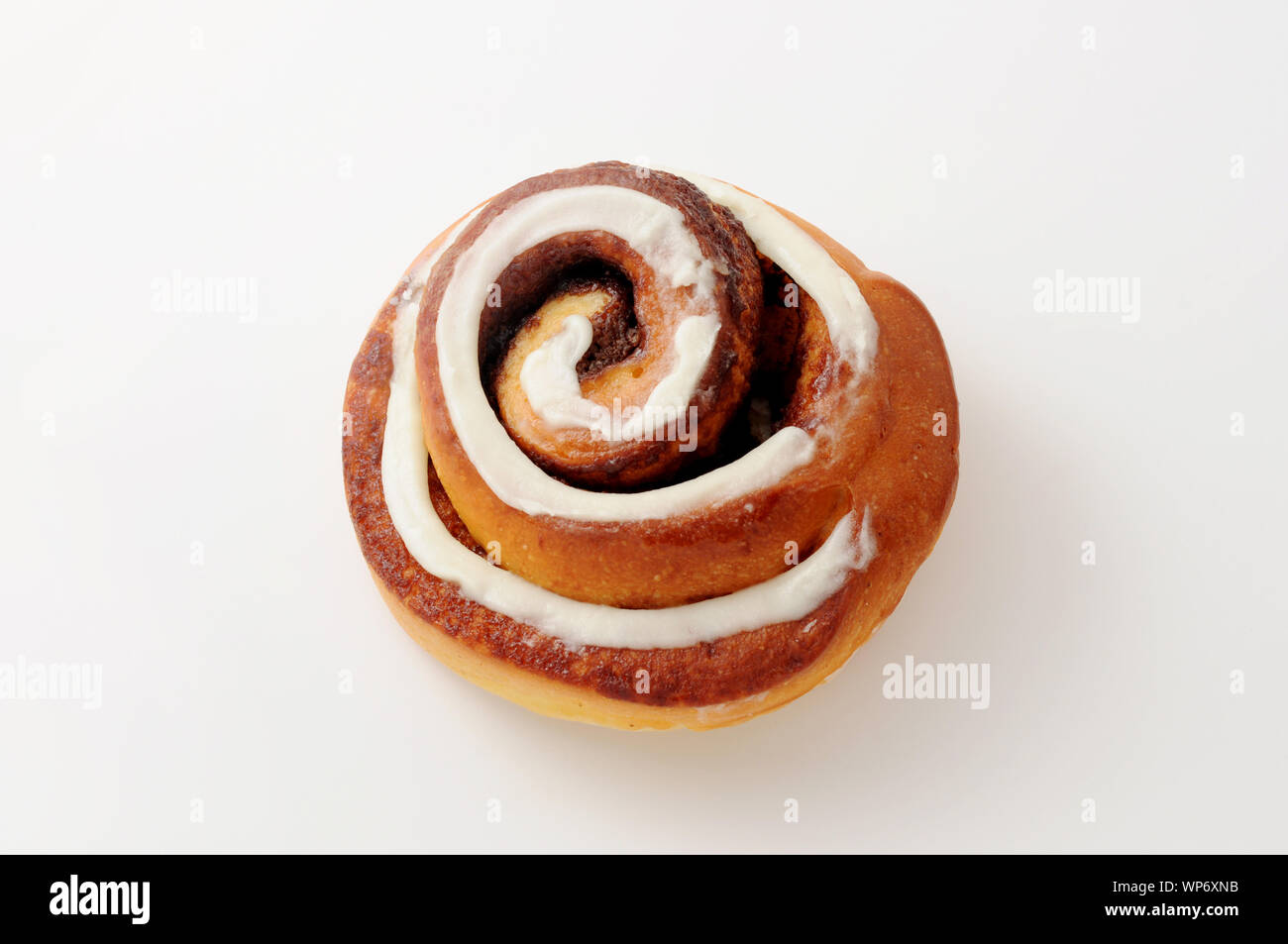 Cinnamon roll closeup isolated on white background Stock Photo - Alamy