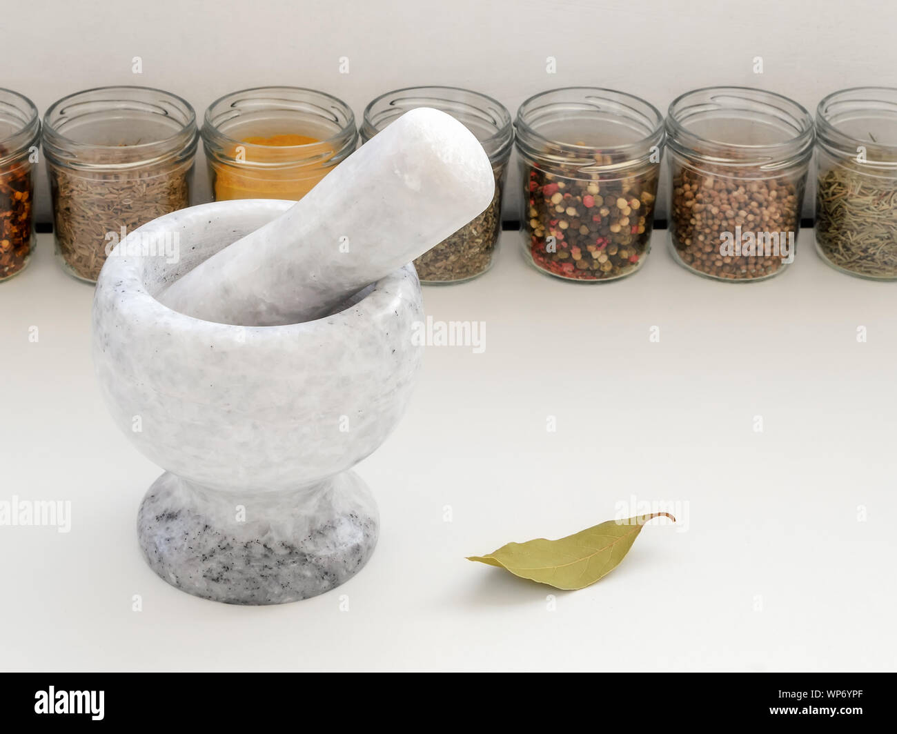 Marble or granite mortar with pestle for manual grinding and glass jars ...