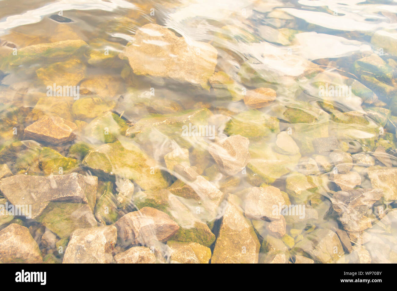 Stones under water at the bottom of the river - background Stock Photo ...
