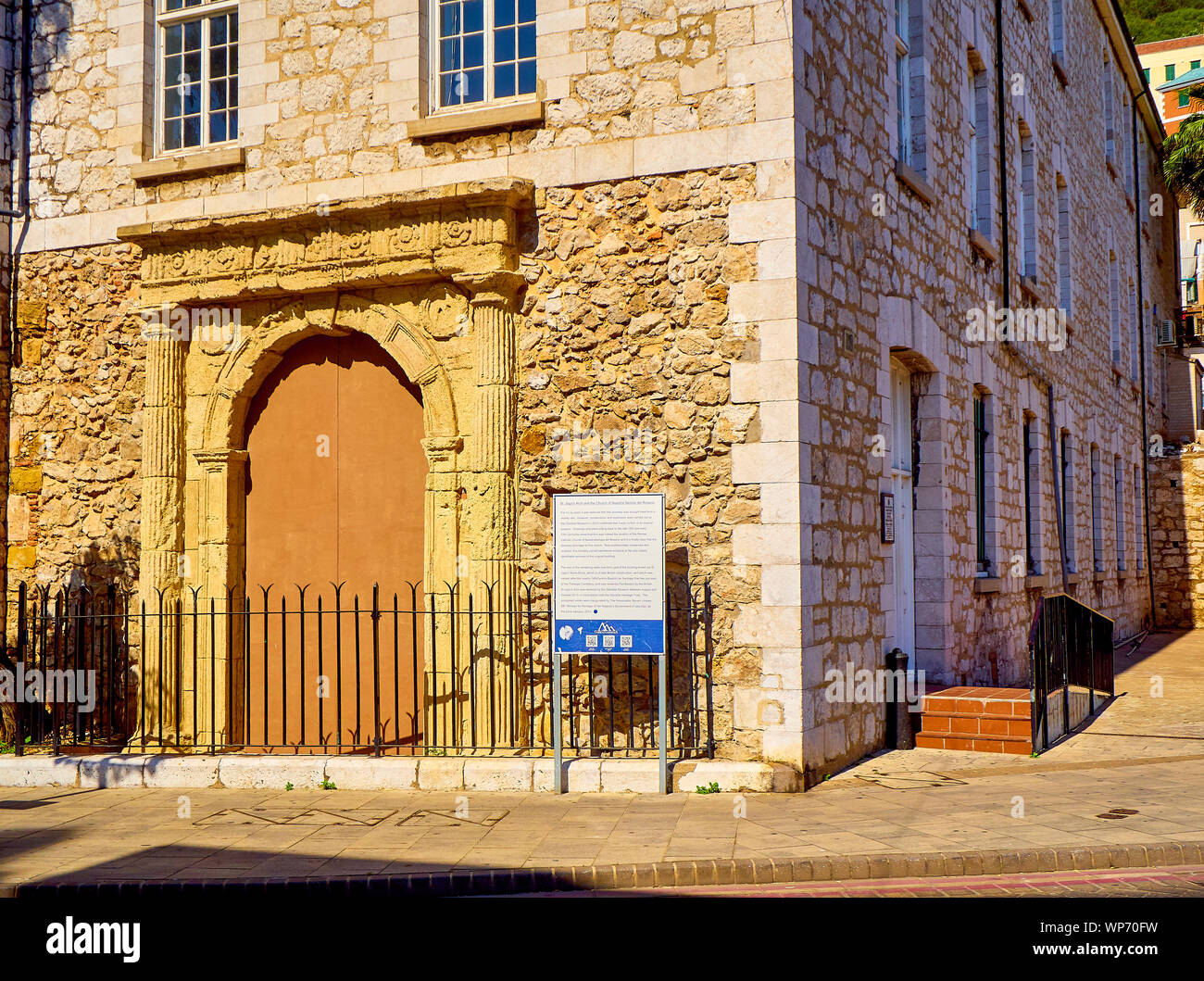 Arch of Saint Jago. A ornate sandstone arch is set into the western ...
