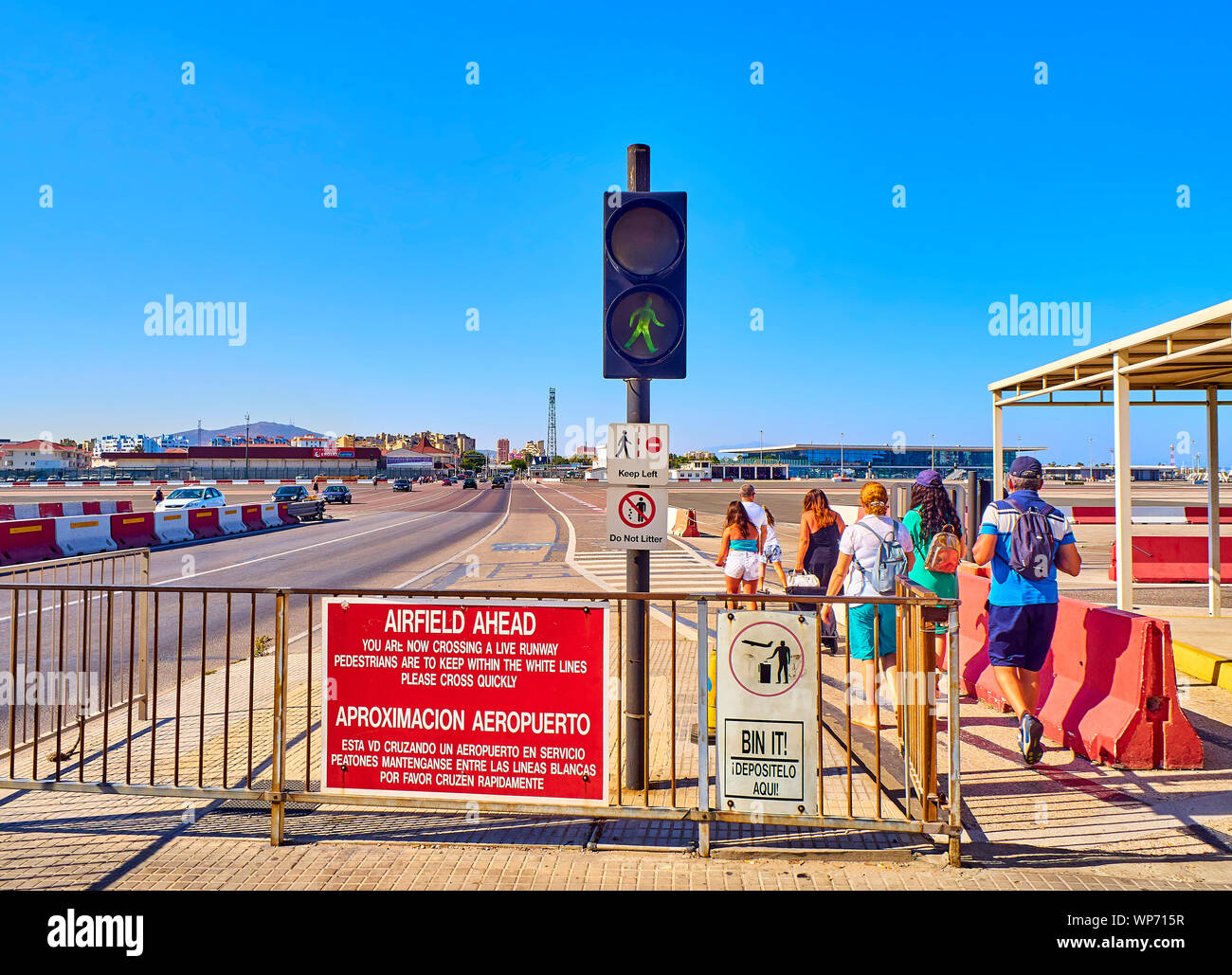 Locals and cars crossing the runway at the Gibraltar Airport with the ...