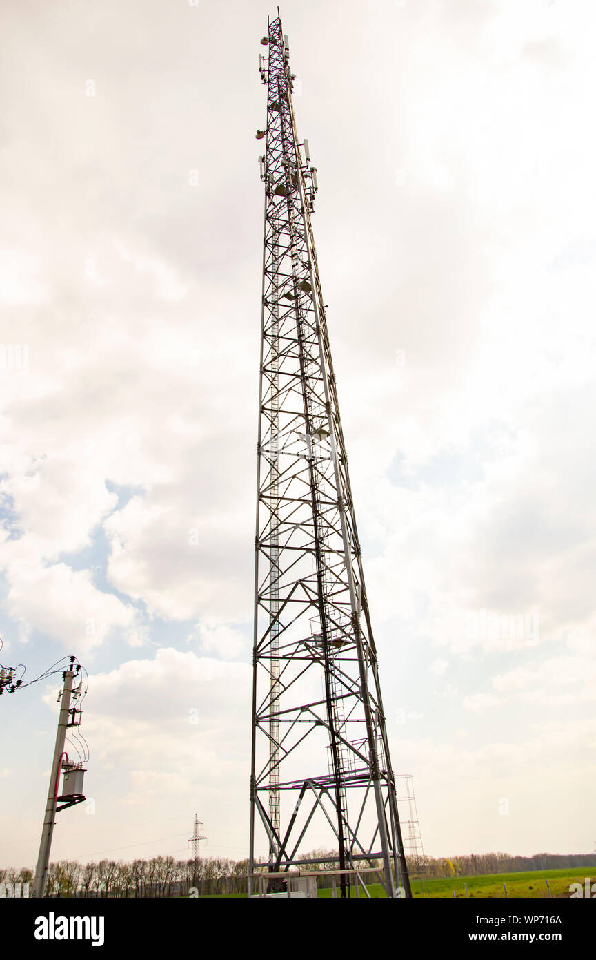 Mobile communications tower on sky background Stock Photo - Alamy