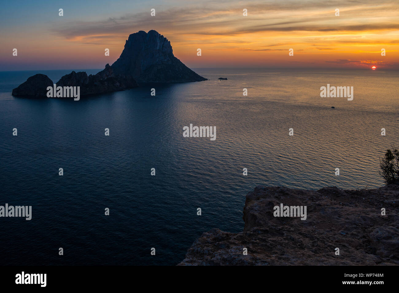 Sunset on mediterranean sea at Ibiza with Es vedrà Island Stock Photo ...