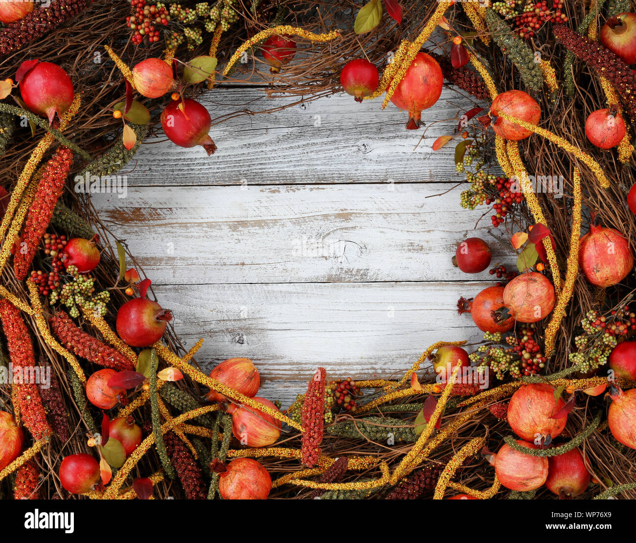 Thanksgiving autumn decorations in circle border on white rustic wood ...
