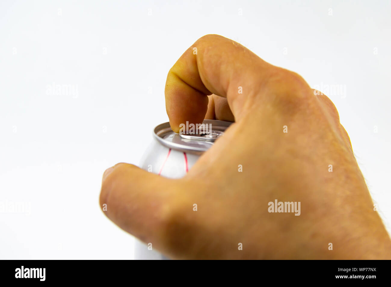 Aluminum can for drinks in the hands of a man on a white background ...