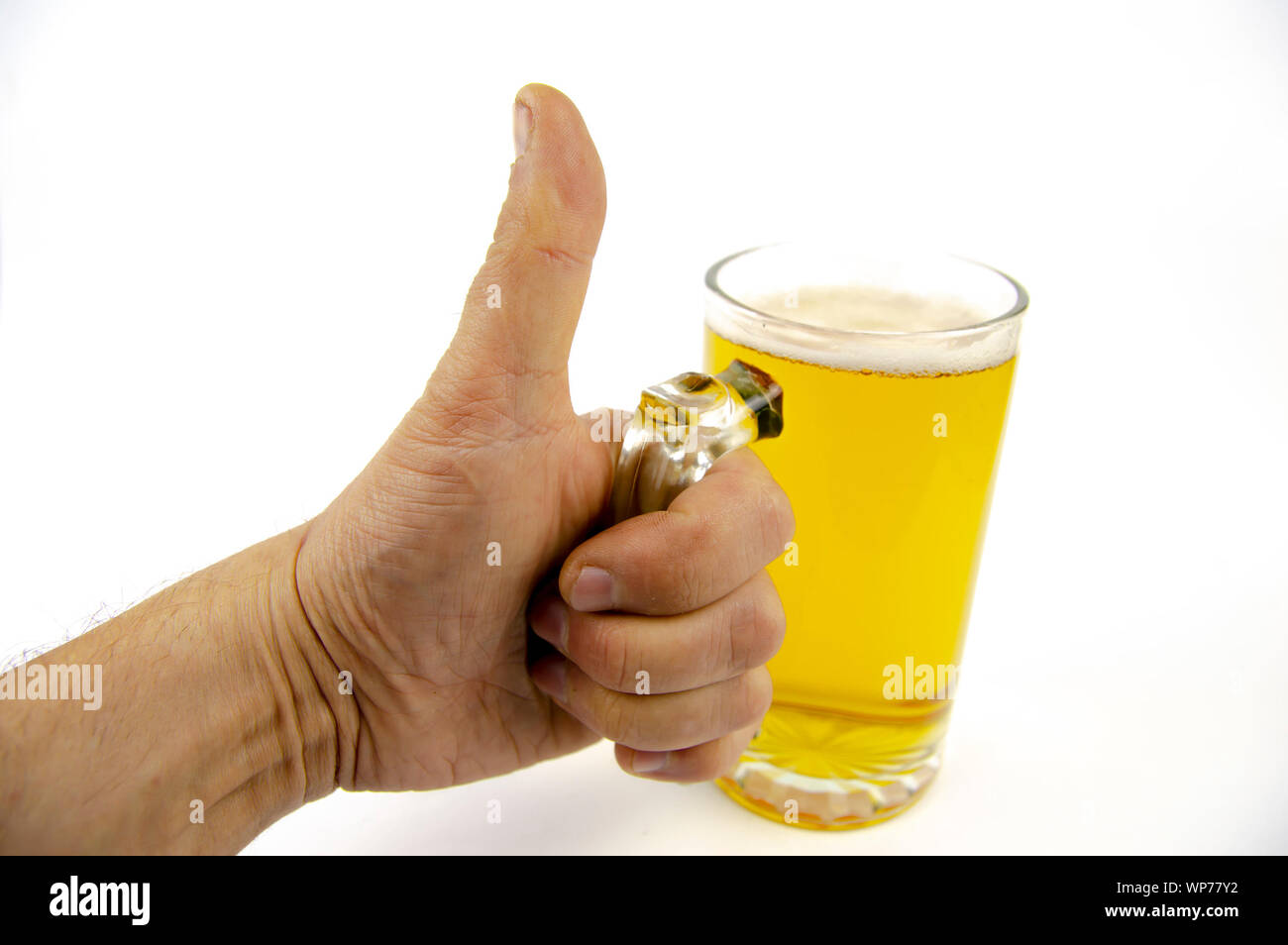 Glass mug of beer in man's hand on white background Stock Photo - Alamy