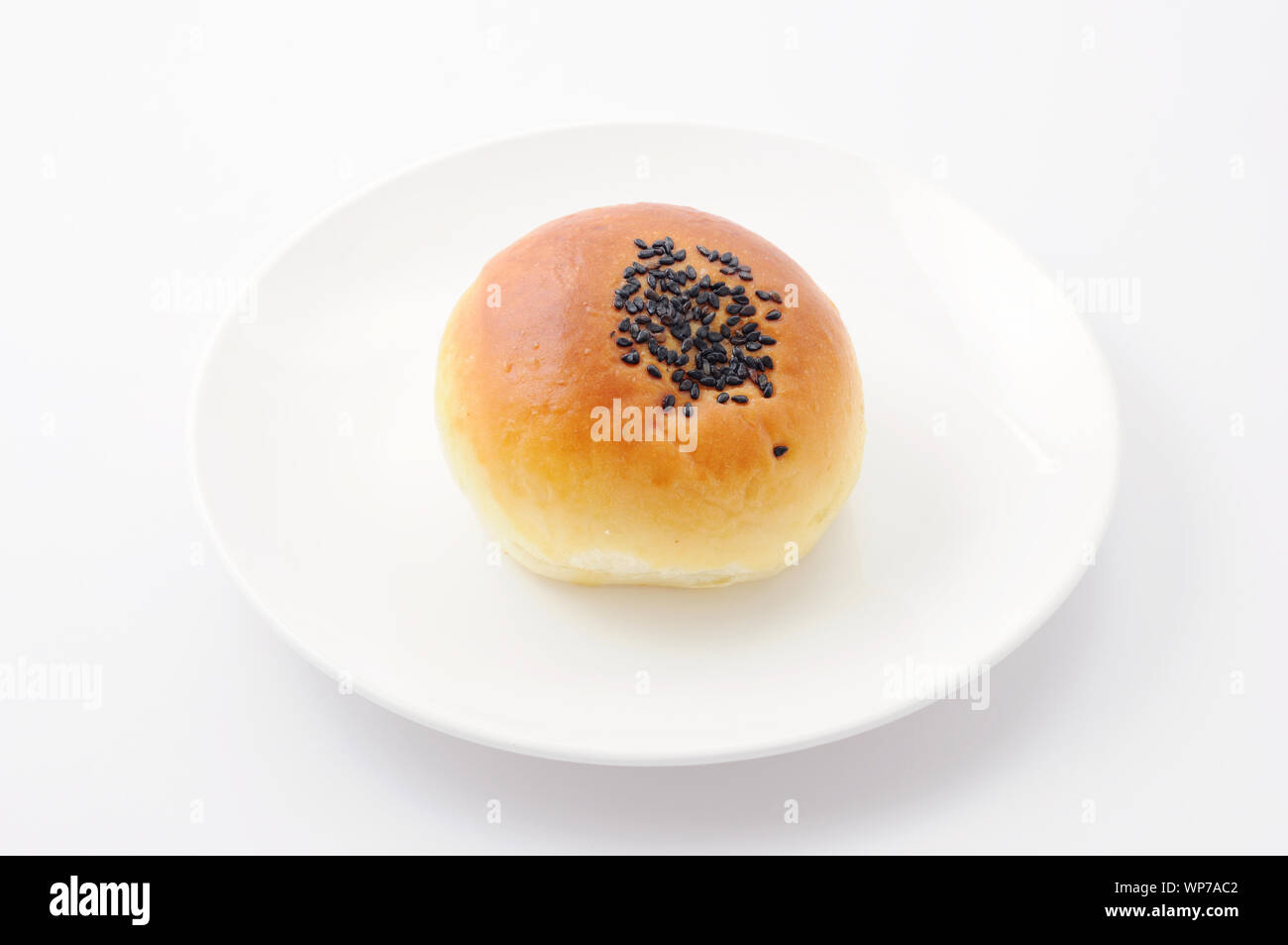 round bread with sesame isolated on white background Stock Photo - Alamy