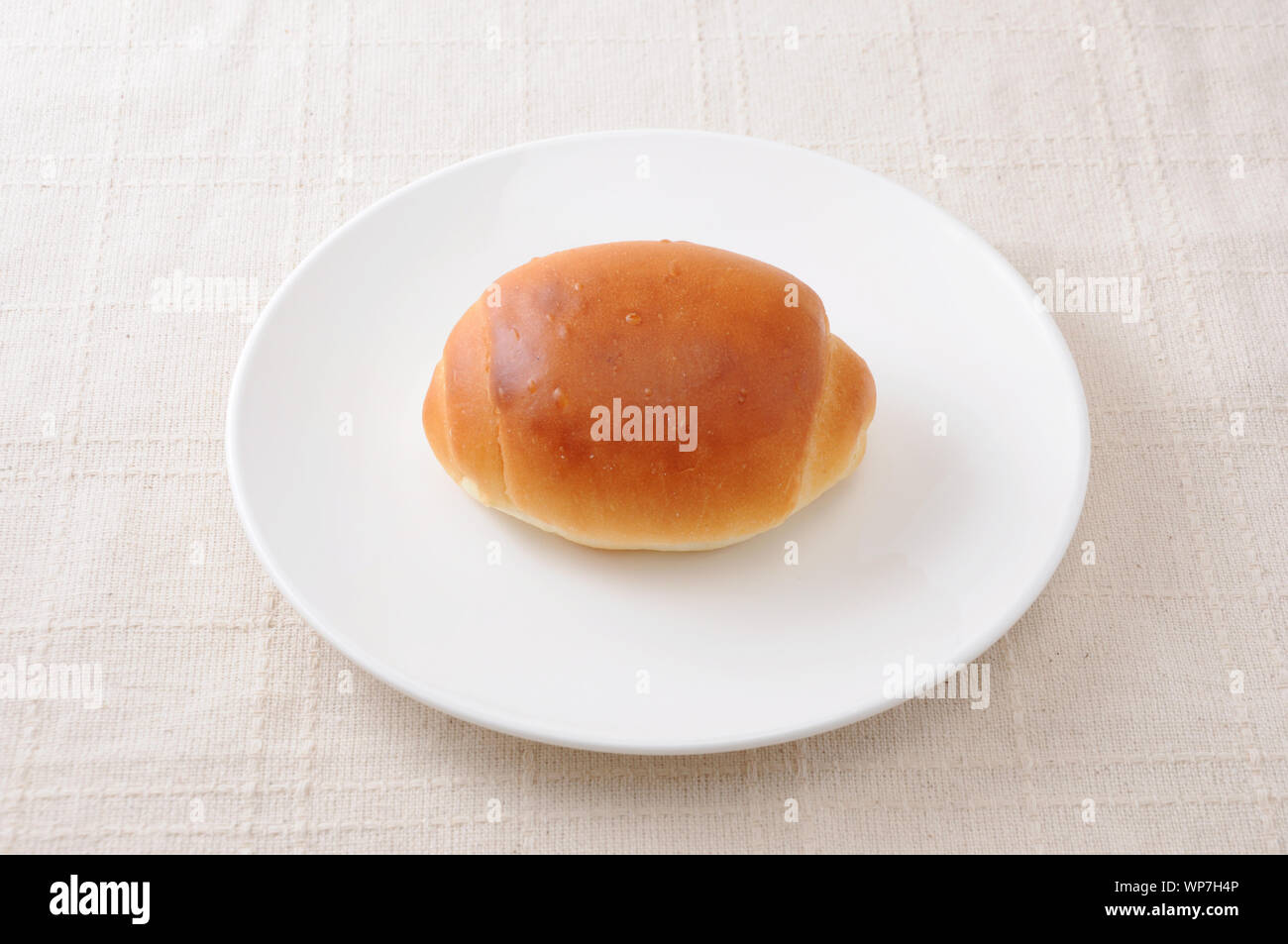 butter bread roll closeup isolated on white background Stock Photo - Alamy