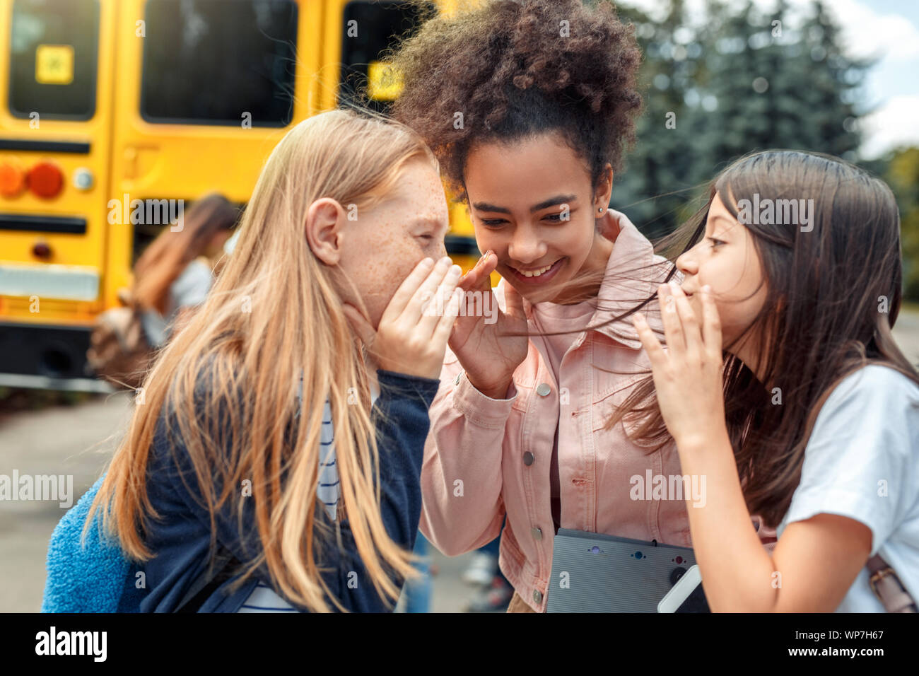Children talking school bus hi-res stock photography and images - Alamy