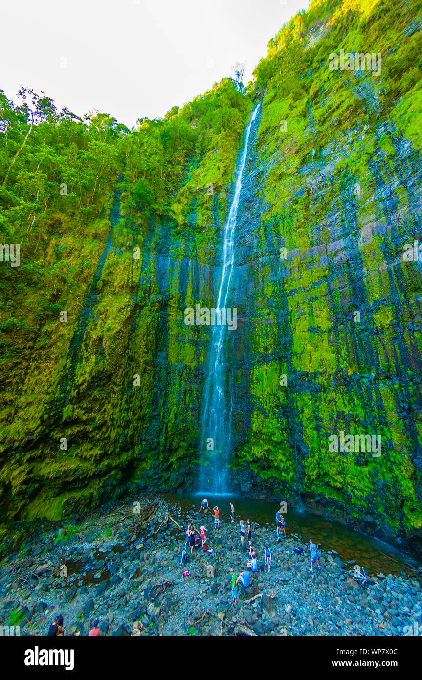 People enjoying the water of Wailua Falls on the Road to Hana, Maui ...
