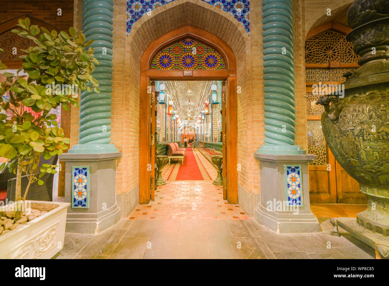 DOHA QATAR - JULY 11 2019; Night scene in Souq Waqif ornate entrance to ...