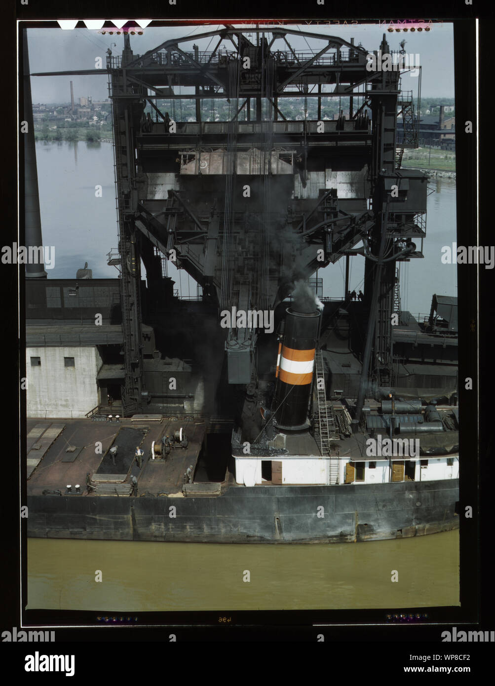 Loading coal into a lake freighter at the Pennsylvania Railroad docks ...