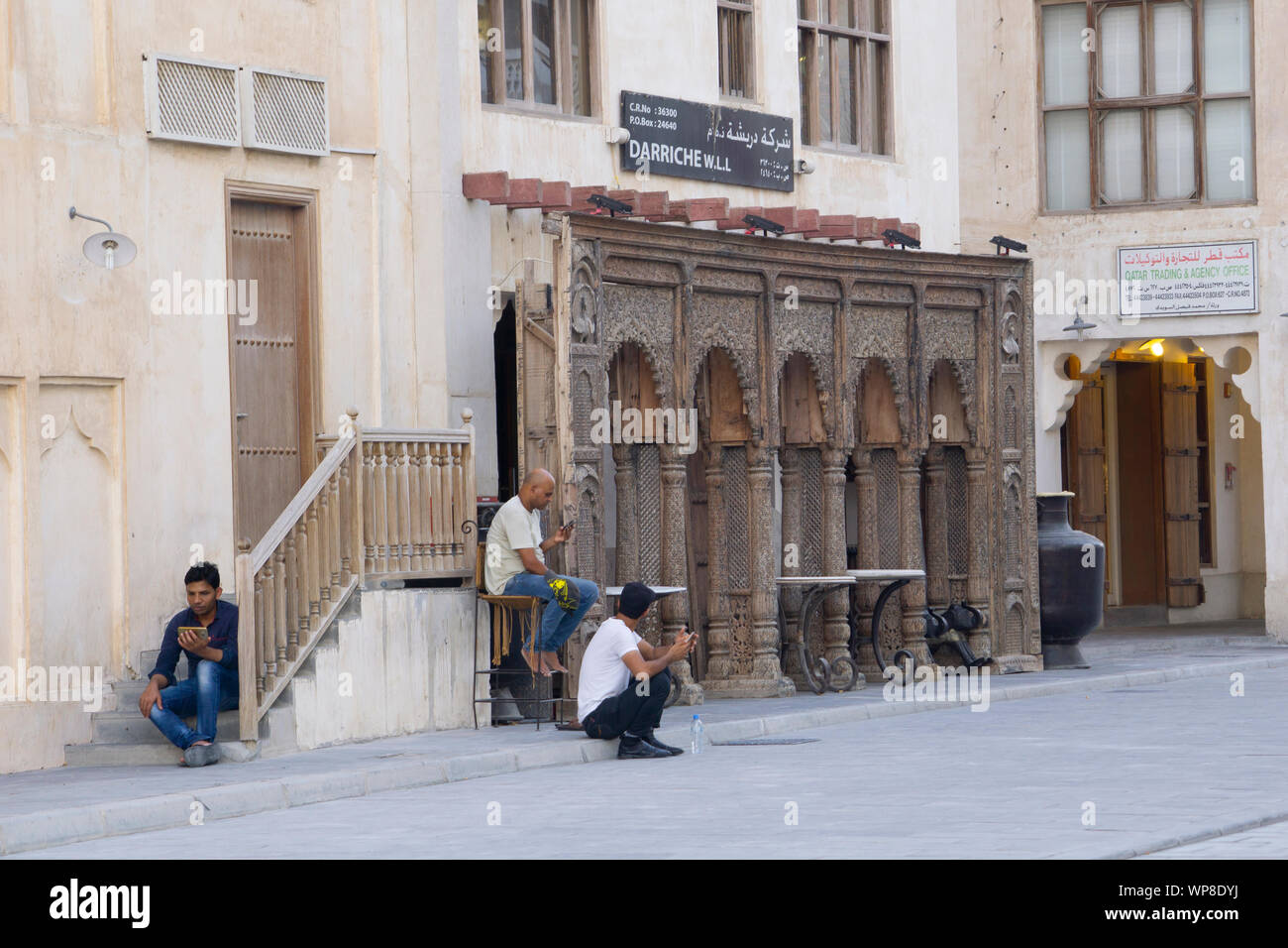 DOHA QATAR - JULY 11 2019; People everywhere are connected here three ...