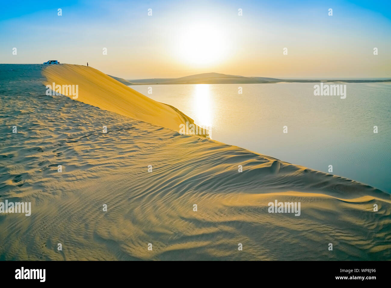 Desert at sunrise, morning glow over dunes and inland sea of the ...