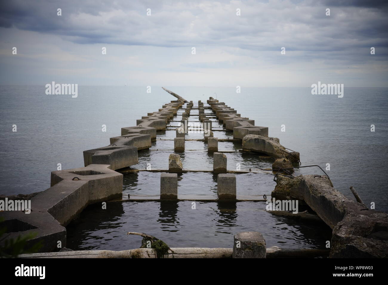 Broken down stone dock stretching onto Lake Michigan in Manitowoc ...