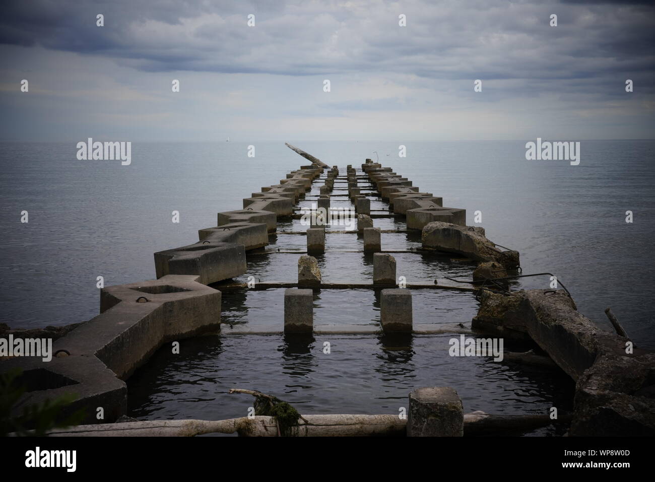 Broken down stone dock stretching onto Lake Michigan in Manitowoc ...