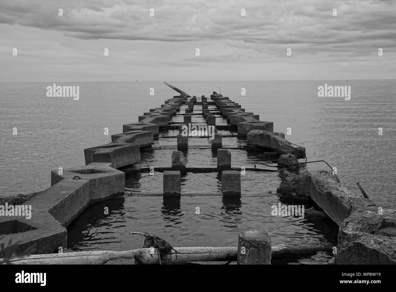 Broken down stone dock stretching onto Lake Michigan in Manitowoc ...