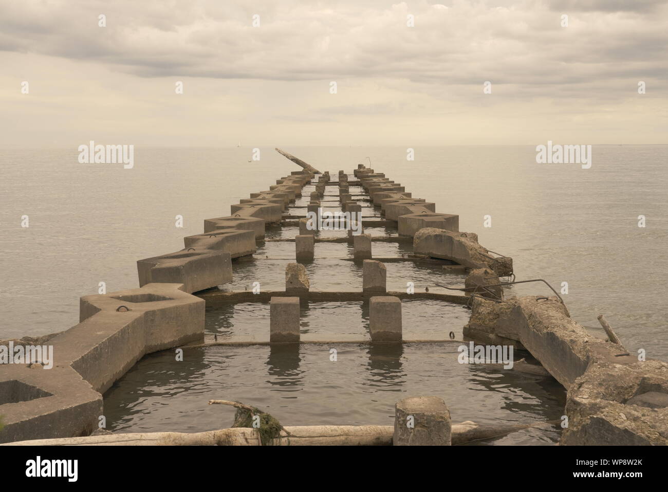 Broken down stone dock stretching onto Lake Michigan in Manitowoc ...