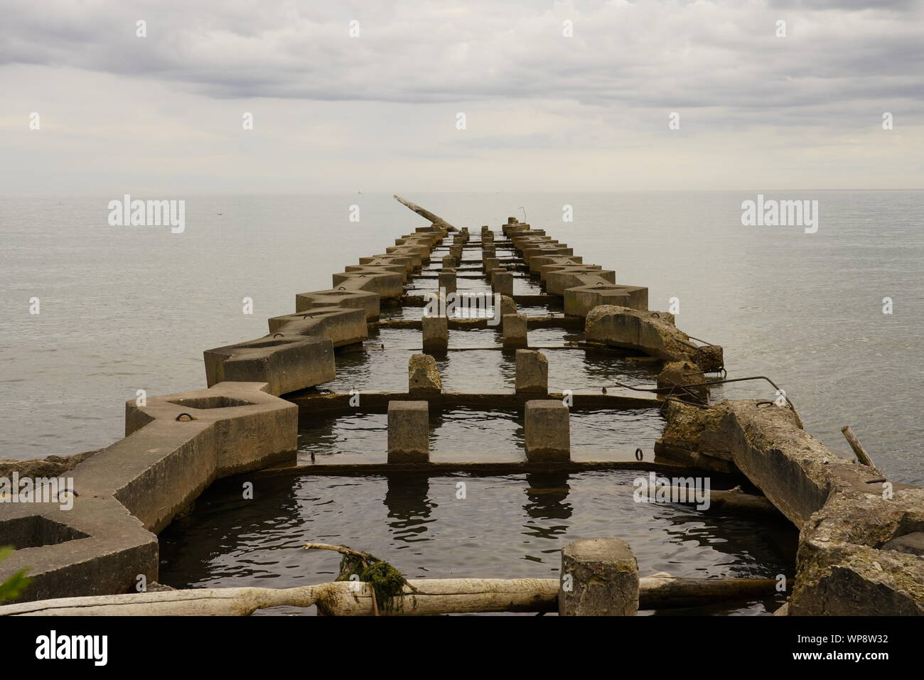 Broken down stone dock stretching onto Lake Michigan in Manitowoc ...