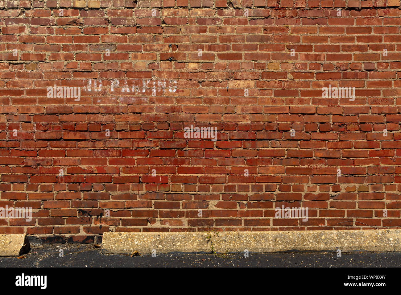 Old brick wall in back lot Stock Photo - Alamy