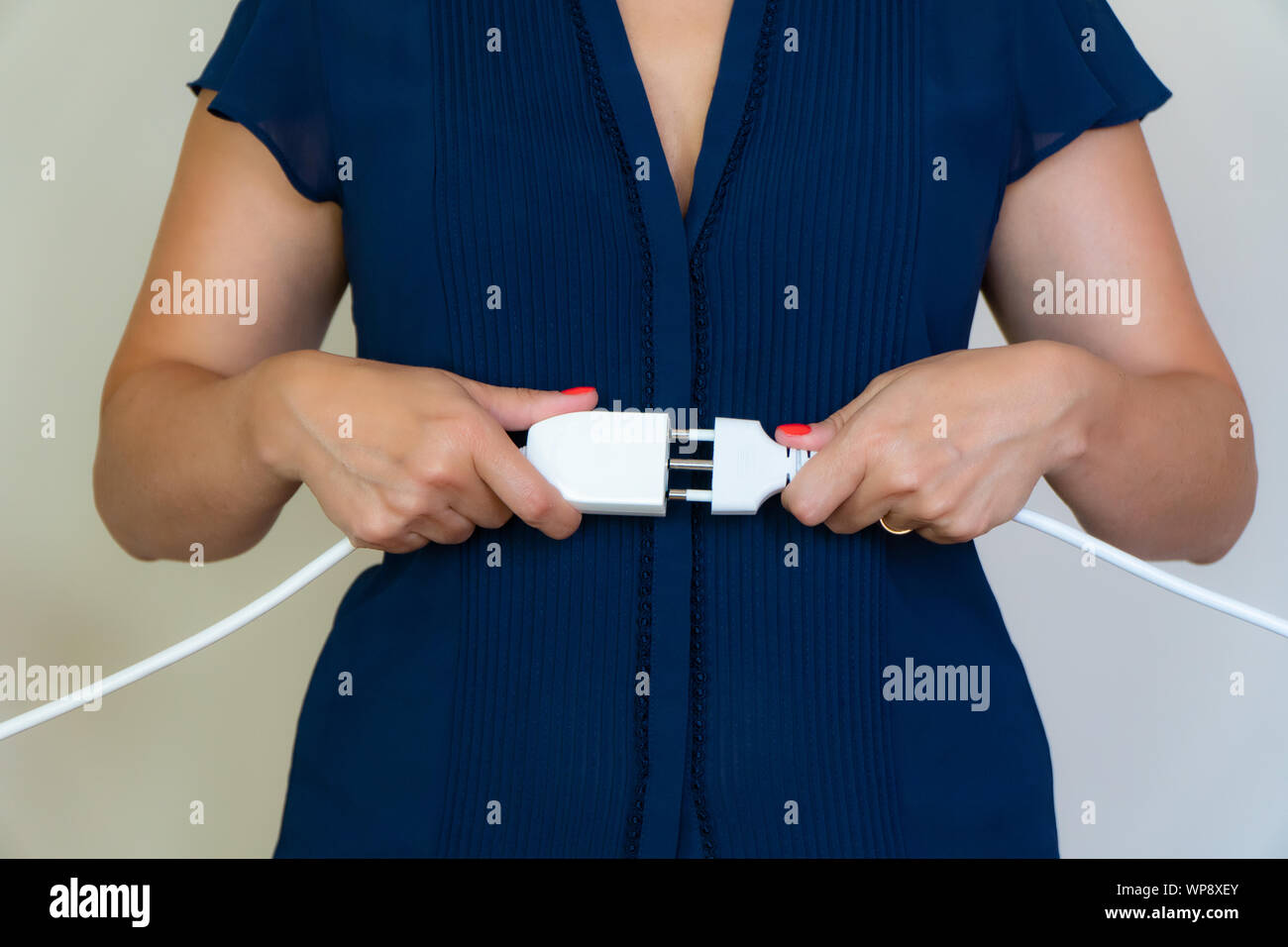 Woman holding two cables hi-res stock photography and images - Alamy
