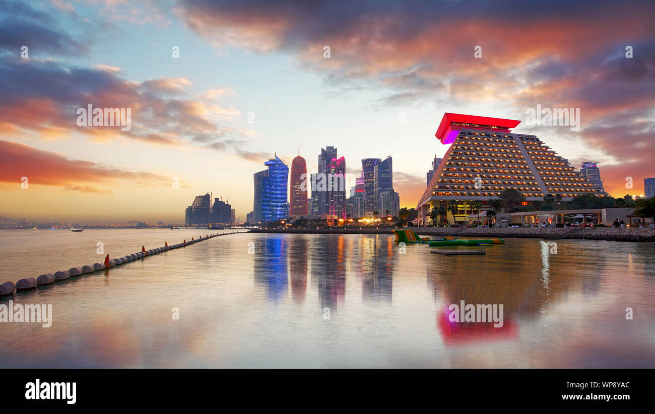 Doha city skyline city center after sunset, Qatar Stock Photo - Alamy