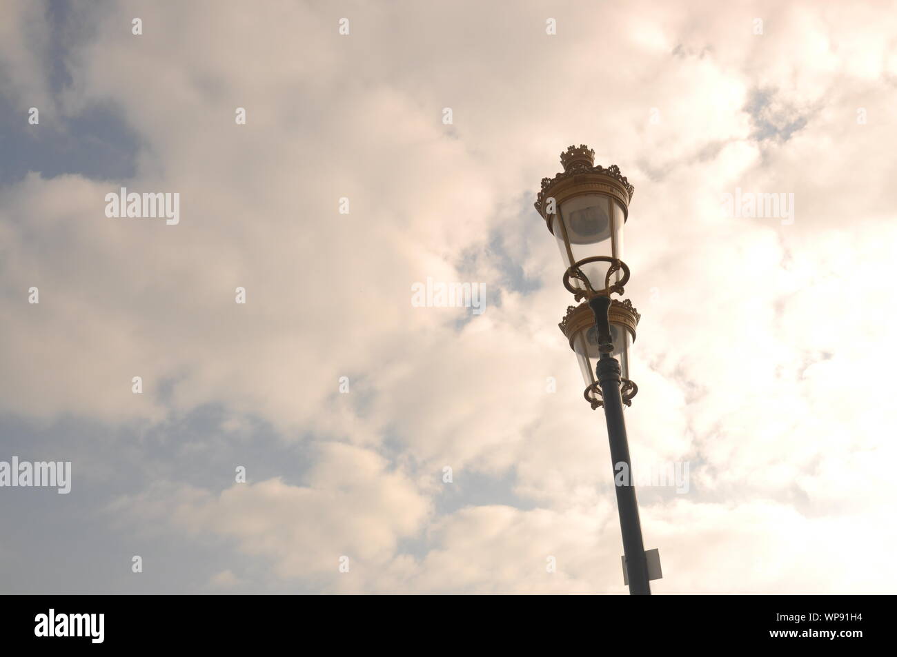 High pillar of street lighting Stock Photo - Alamy