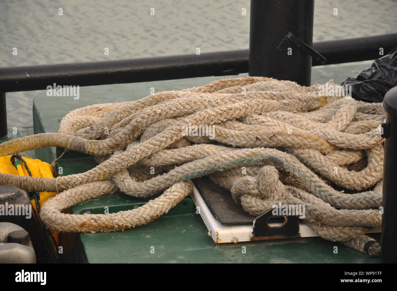 A long, thick rope on a boat Stock Photo - Alamy