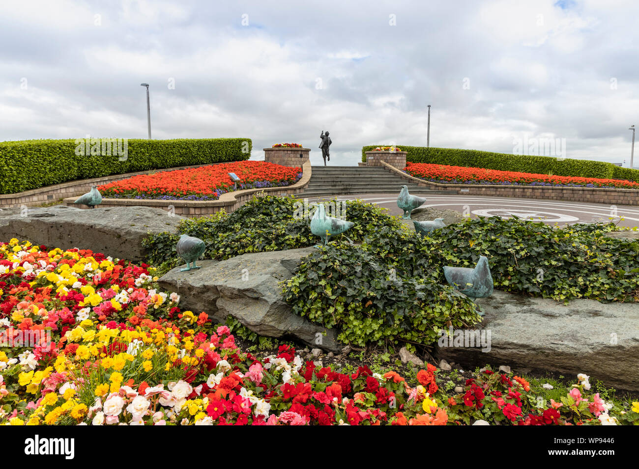Bronze statue of famous English comedian Eric Morecambe at the seafront ...