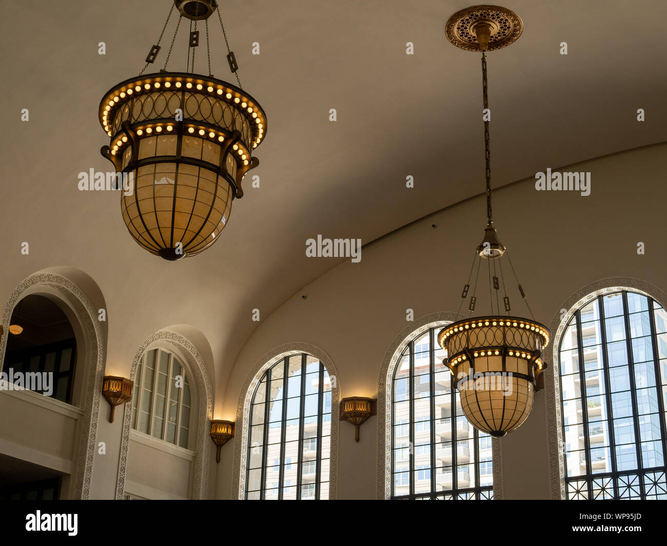 Onate chandeliers hanging during daytime in large building Stock Photo ...