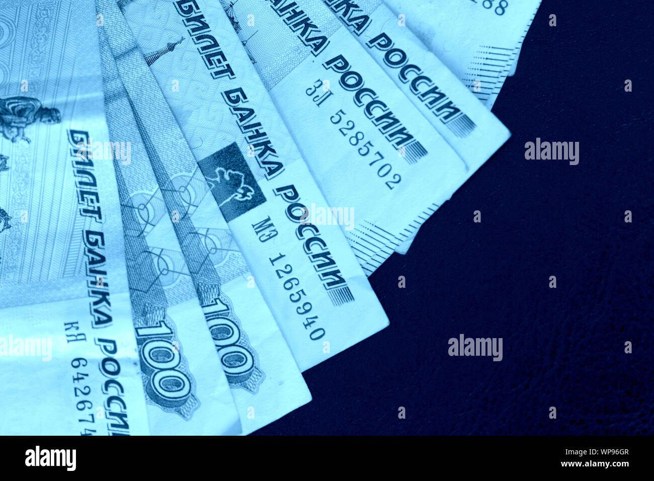 Banknote background from Russian rubles close up. Blue color toned ...