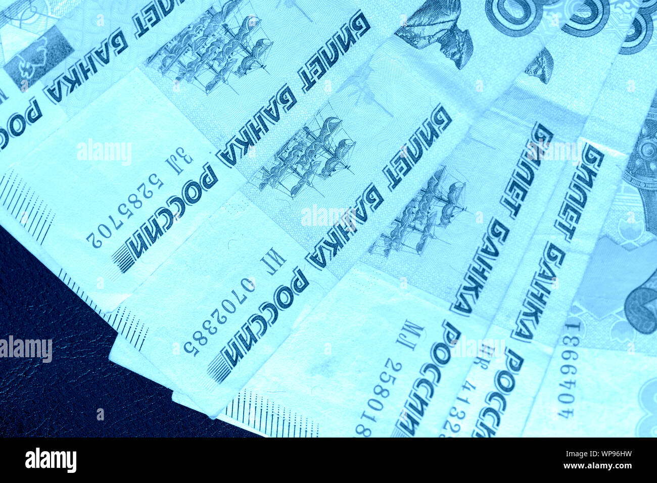 Banknote background from Russian rubles close up. Blue color toned ...