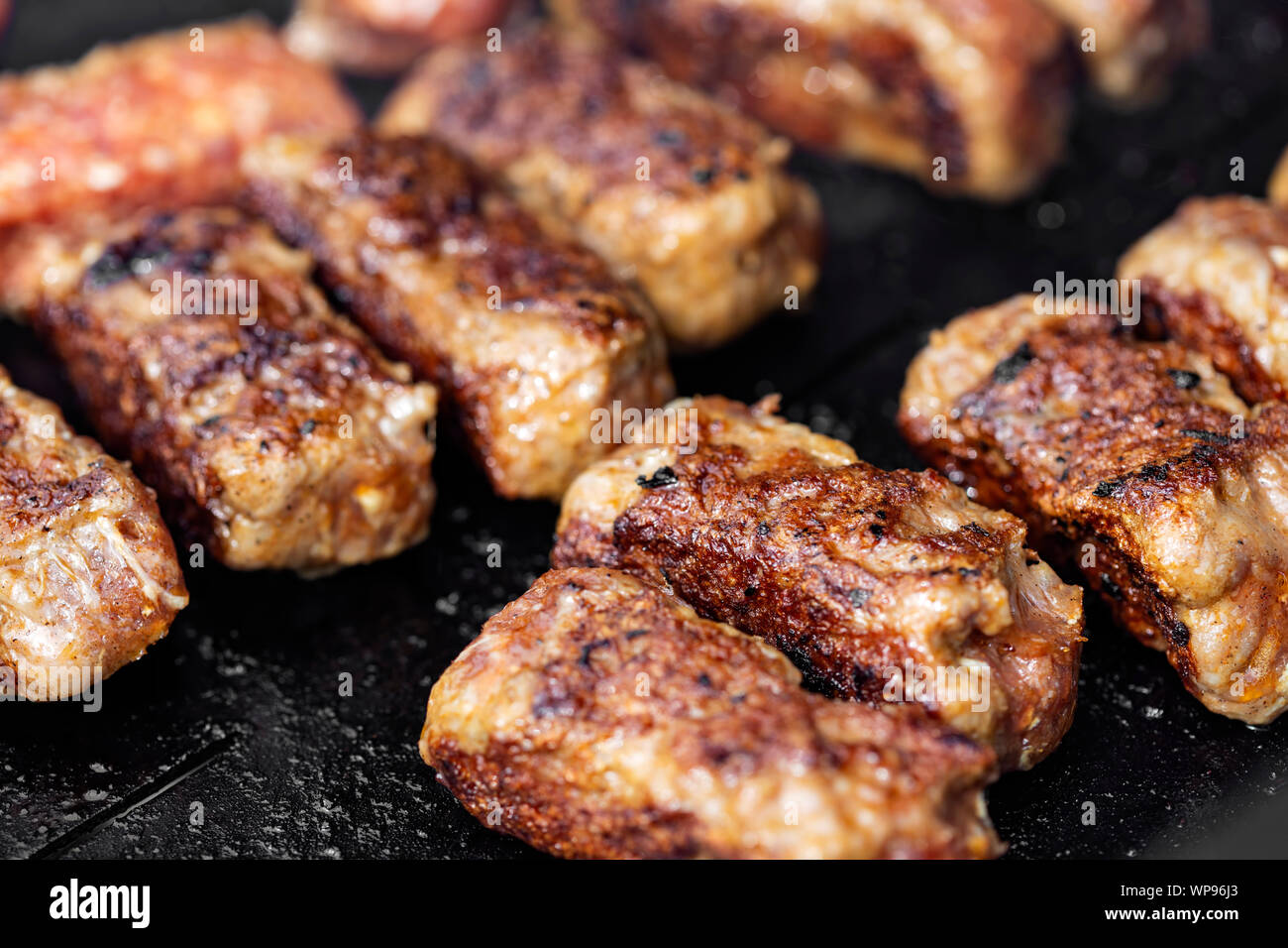 Grilled meat rolls called Mici or Mititei, traditional Romanian food ...