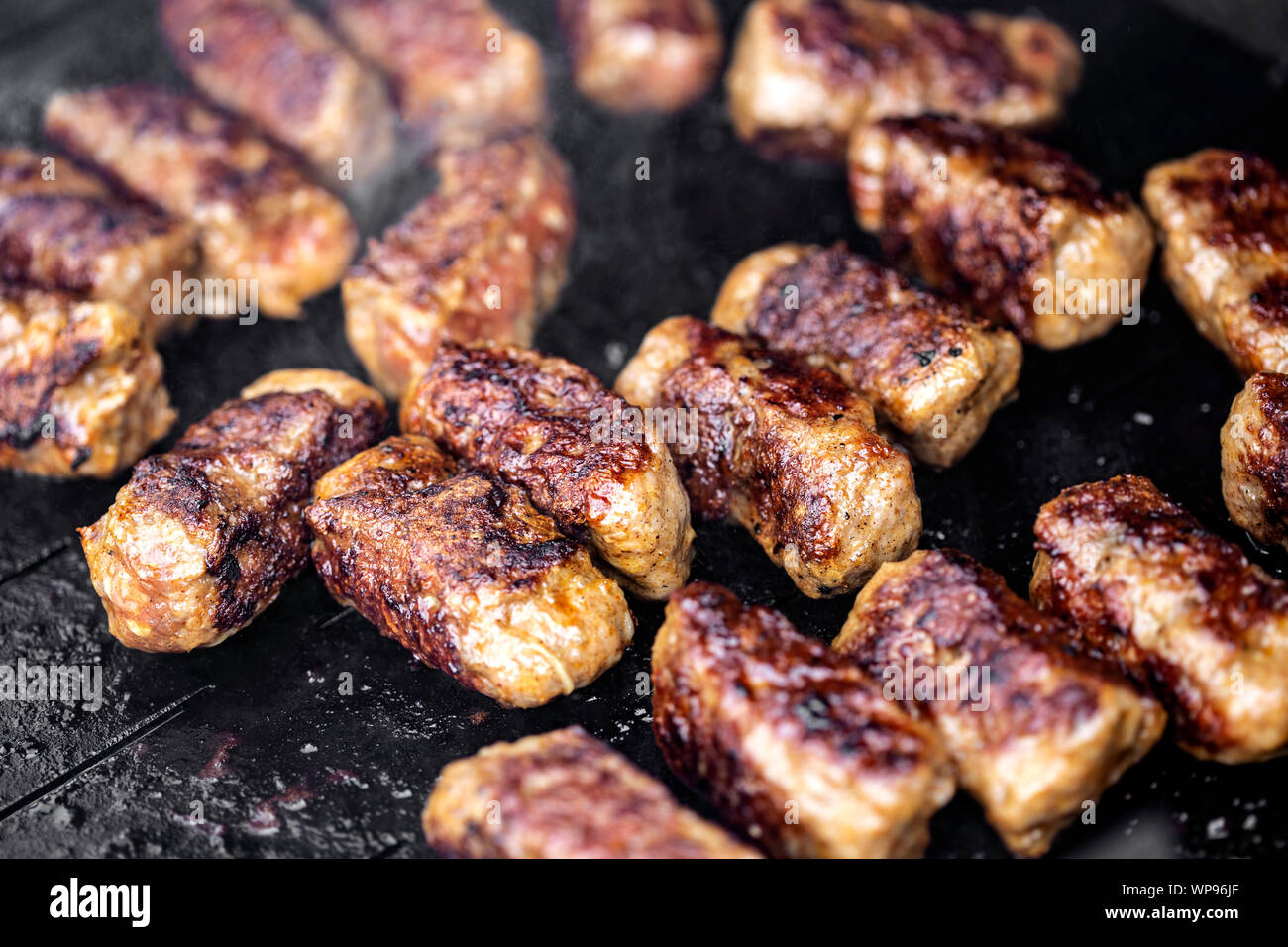 Grilled meat rolls called Mici or Mititei, traditional Romanian food ...