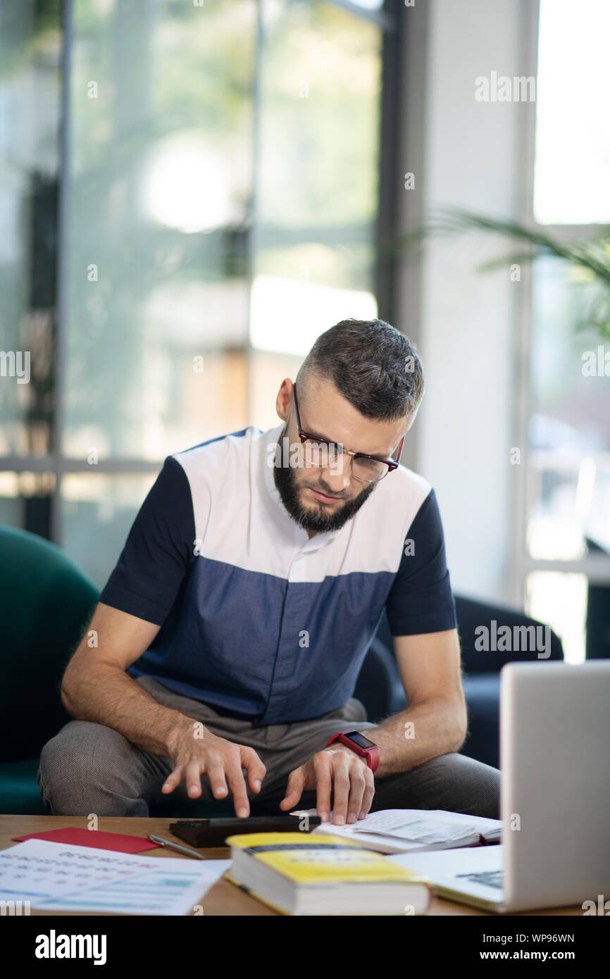 Serious businessman analyzing documents hi-res stock photography and ...