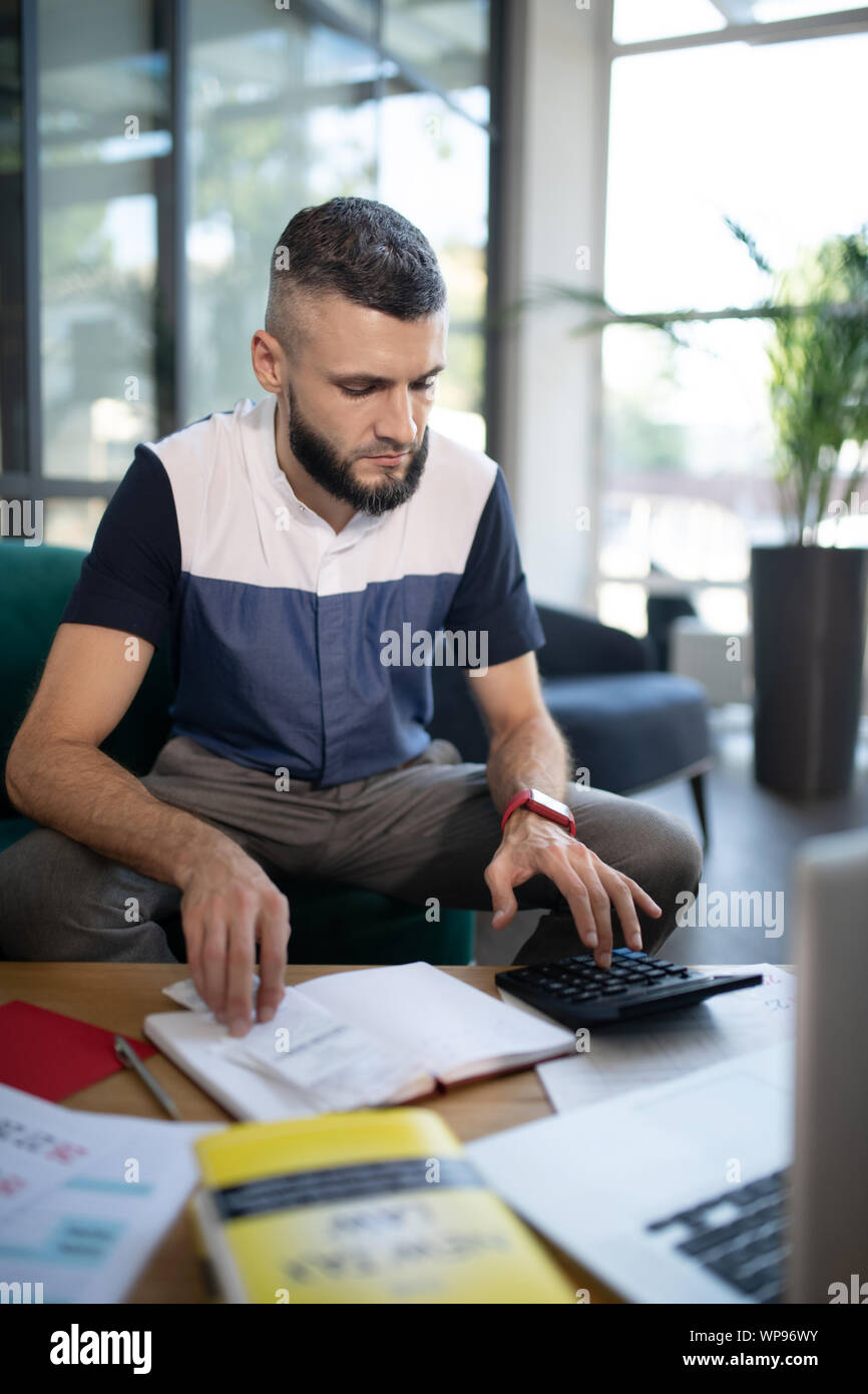 Businessman feeling involved in calculations and accounting Stock Photo ...