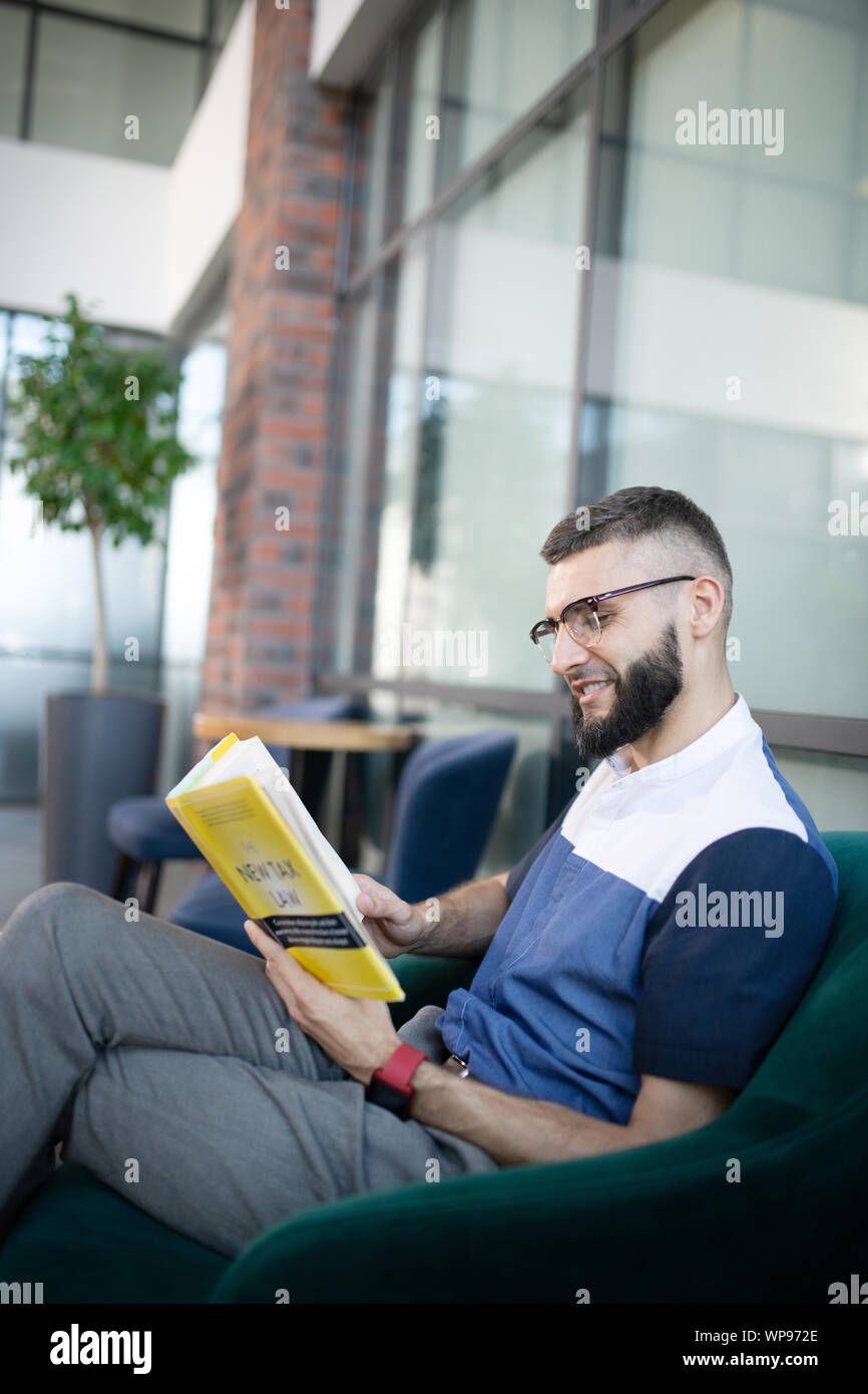 Concentrated handsome bearded businessman reading hi-res stock ...