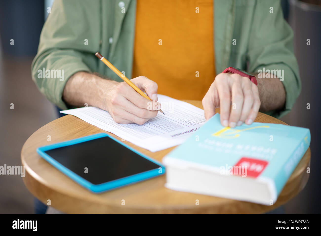 Busy student near laptop and tablet studying hard Stock Photo - Alamy