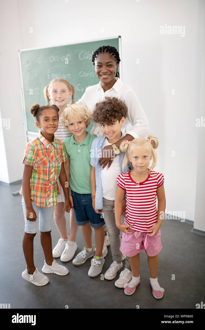 Children teacher hug hi-res stock photography and images - Alamy