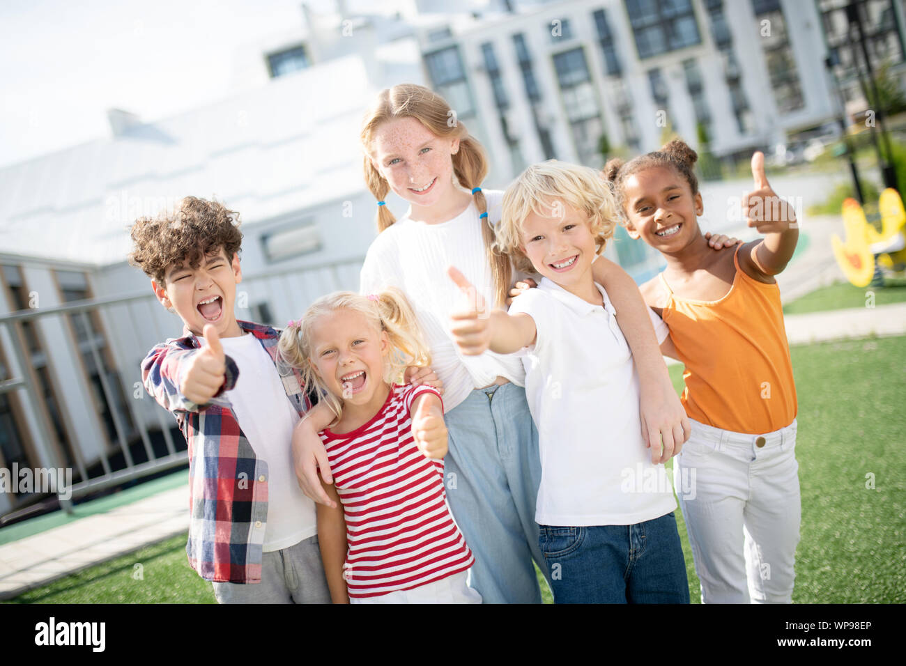 Cheerful children feeling truly happy after amazing day at school Stock ...