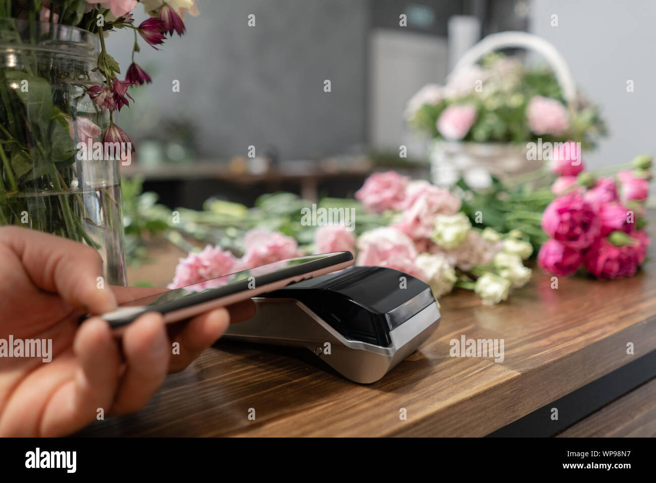 Concept contactless payment. Making payment with smartphone and pos ...