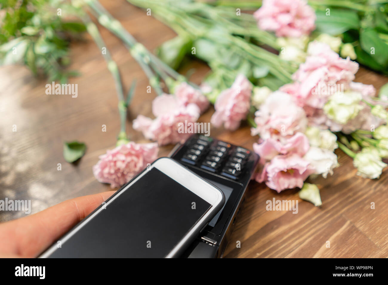 Concept contactless payment. Making payment with smartphone and pos ...