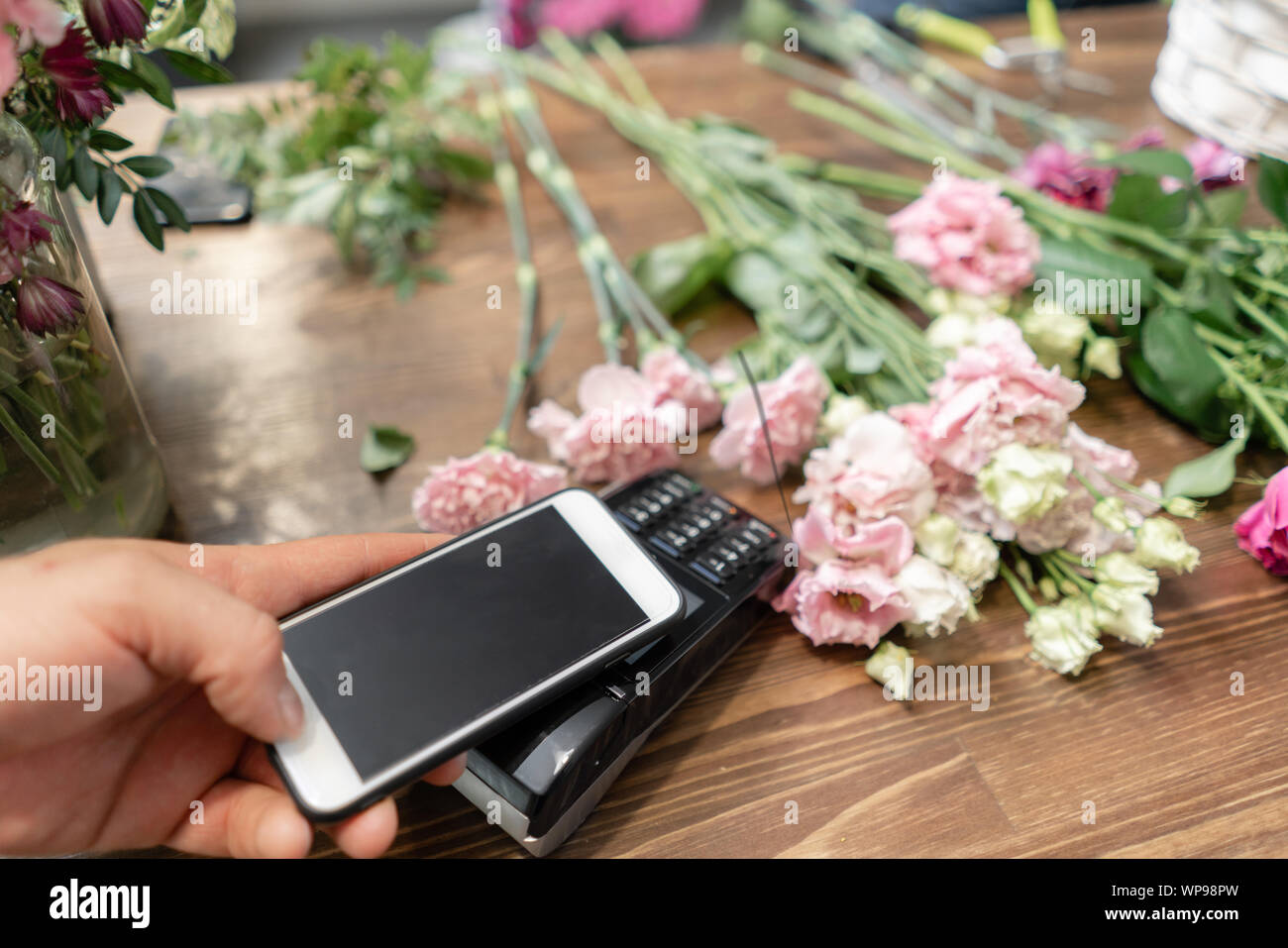 Concept contactless payment. Making payment with smartphone and pos ...