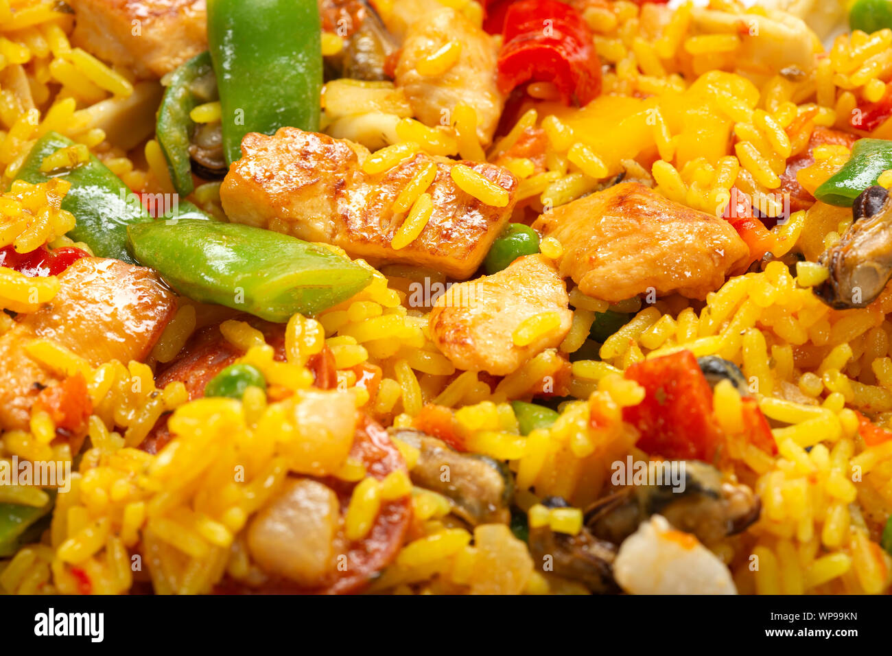 Traditional Spanish paella with seafood and chicken meat - close up ...