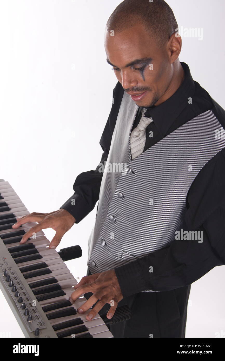 African musician singer with headphones holding a keyboard Stock Photo ...