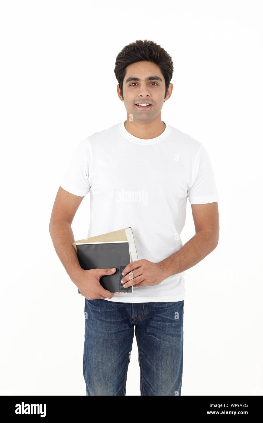 College student holding textbooks Stock Photo - Alamy