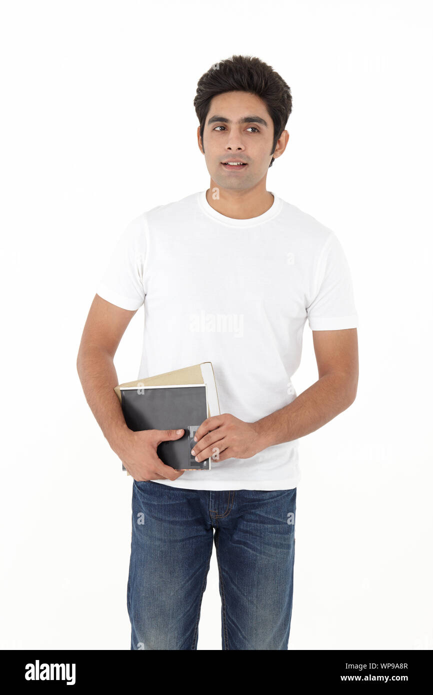 College student holding textbooks Stock Photo - Alamy