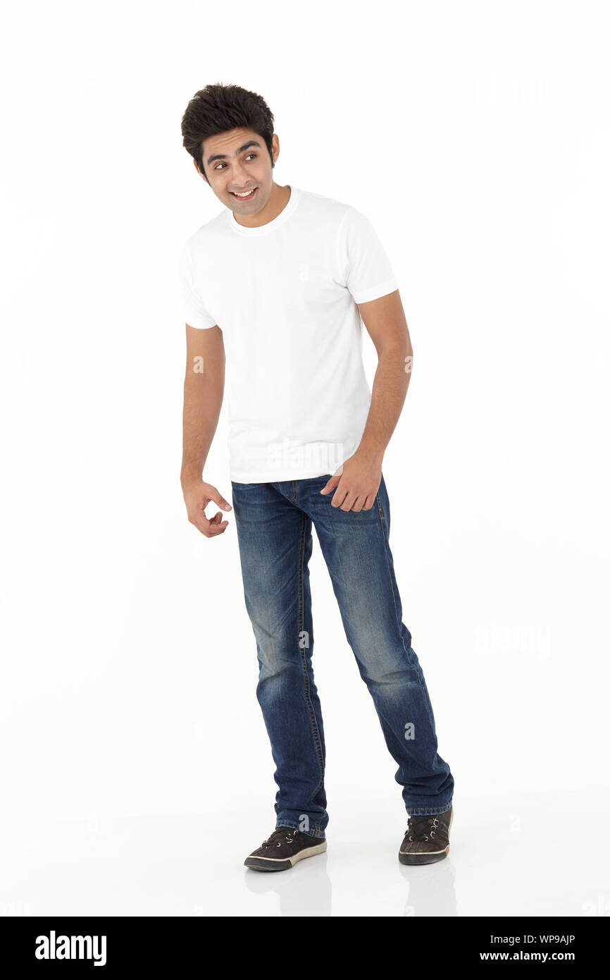 Young man looking something and smiling Stock Photo - Alamy